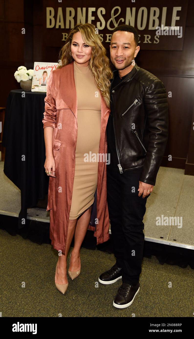 Chrissy Teigen and her husband, singer John Legend, pose together at a ...