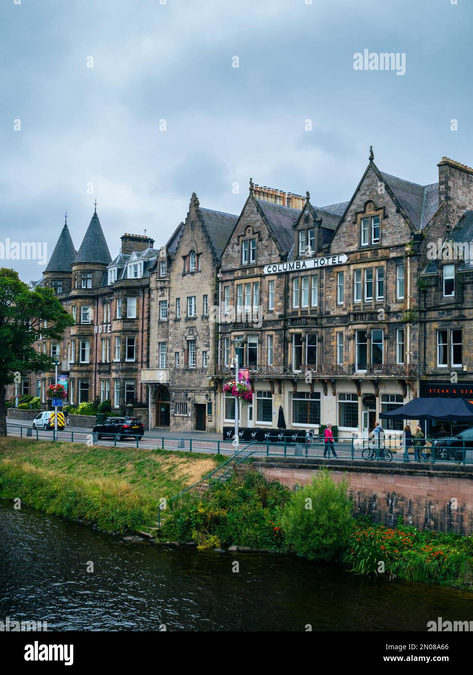 Old stone buildings in centre of Inverness by river Ness, Scotland ...