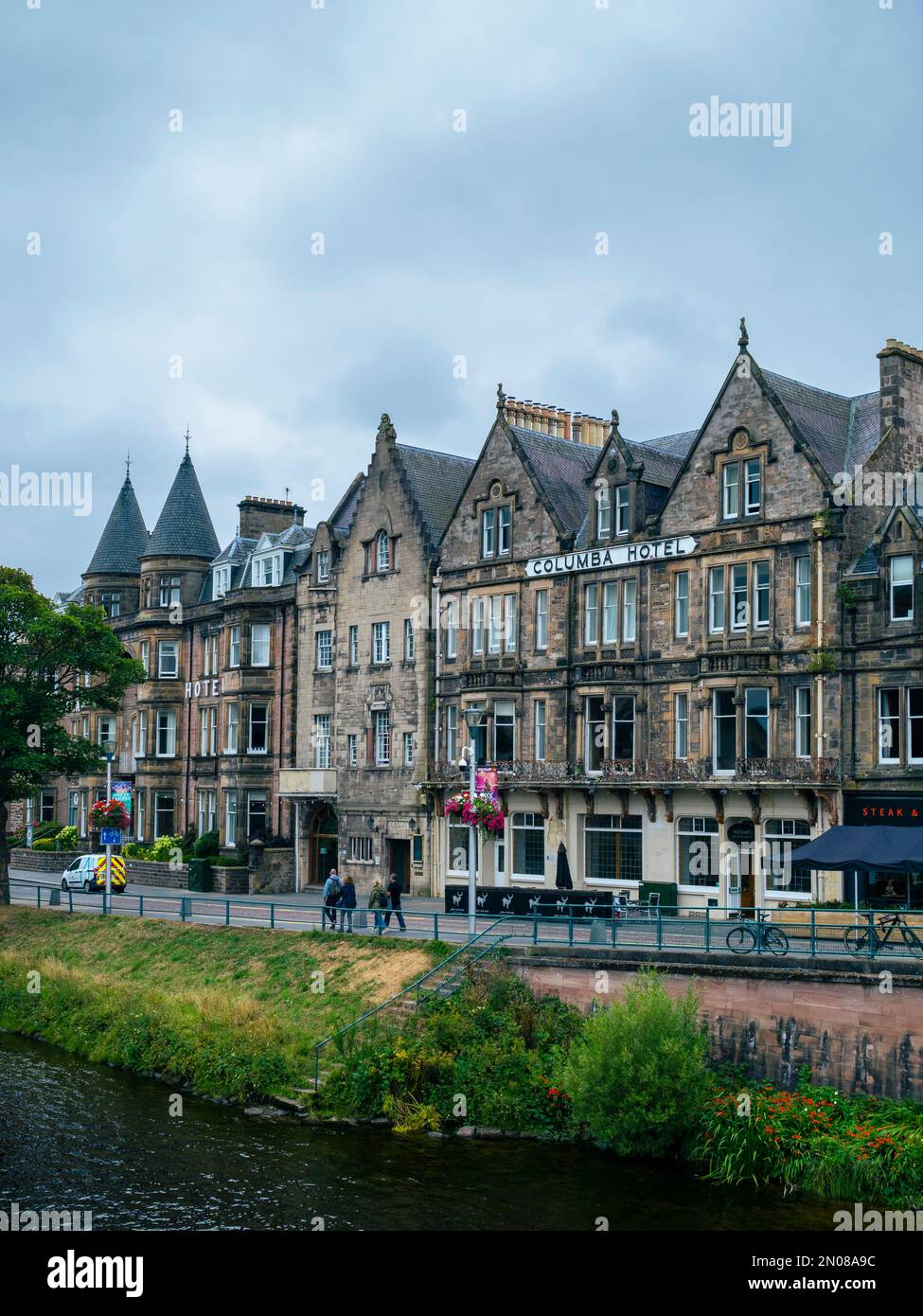 Old stone buildings in centre of Inverness by river Ness, Scotland ...