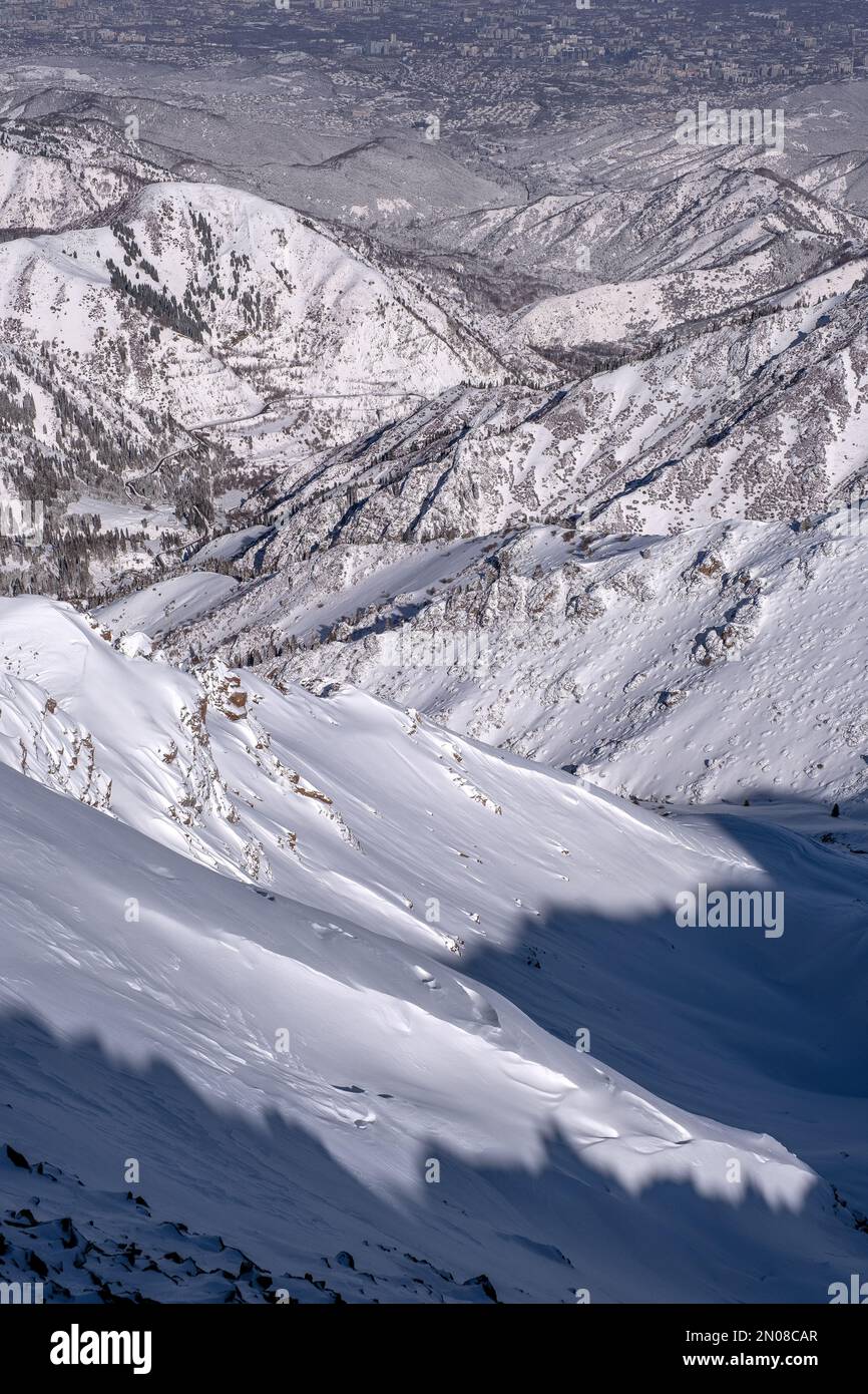 Mountain ridges covered with fresh snow after a recent snowfall; an ...