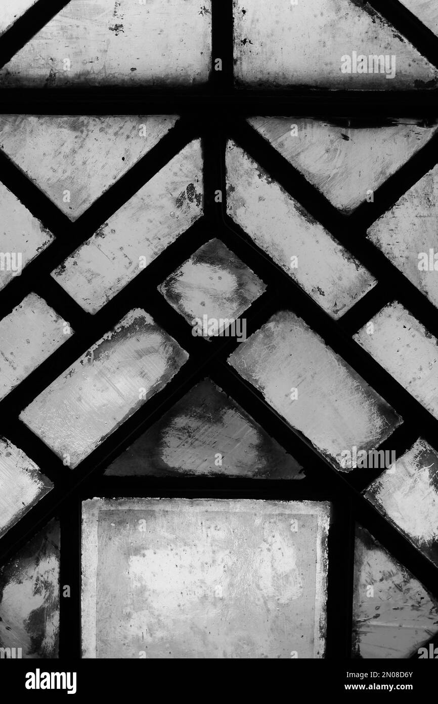 Geometric shapes of a beautiful medieval stained glass window in a ...