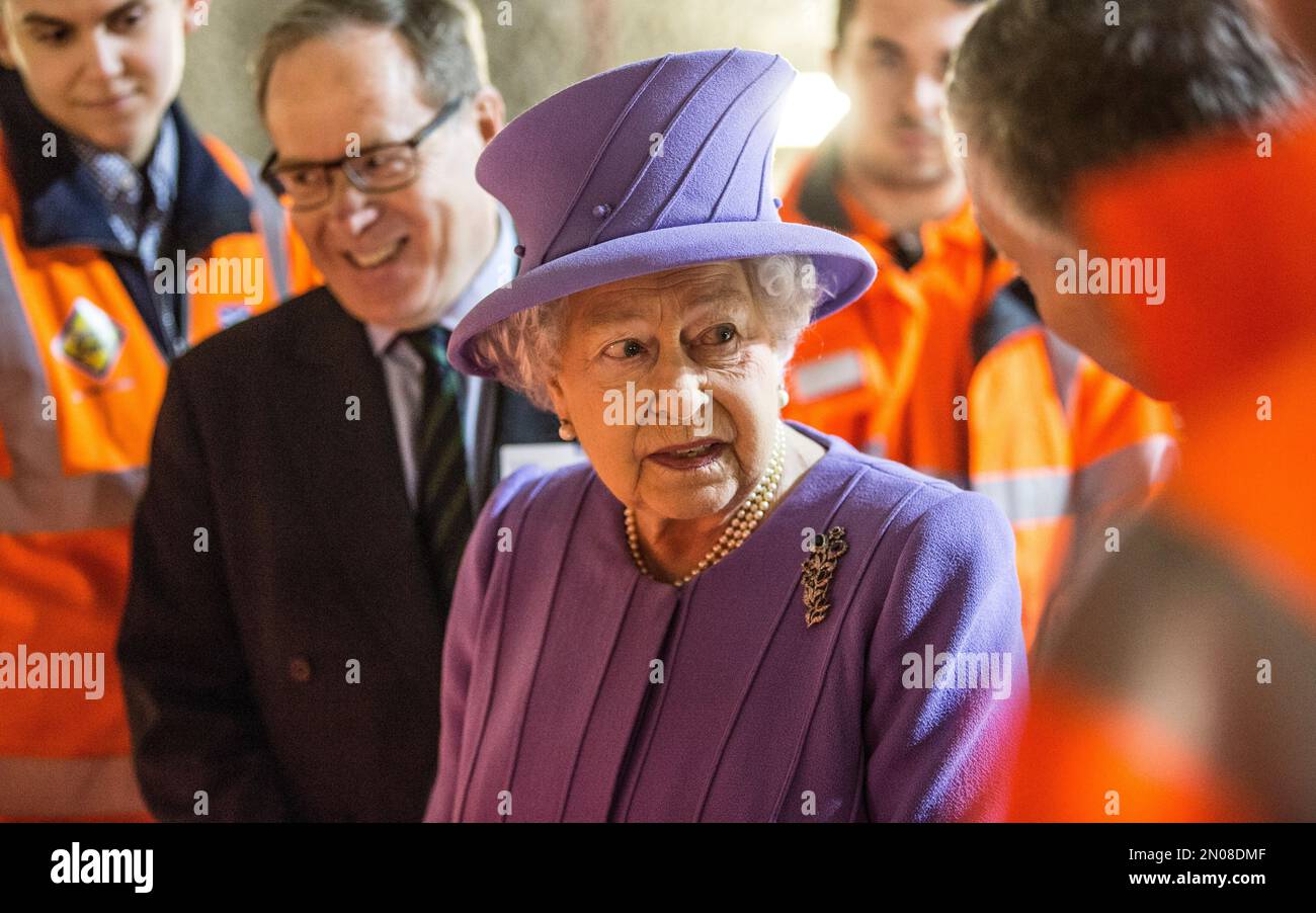 Britain's Queen Elizabeth II talks to Crossrail workers after she ...