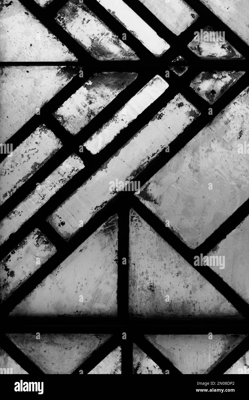 Geometric shapes of a beautiful medieval stained glass window in a ...