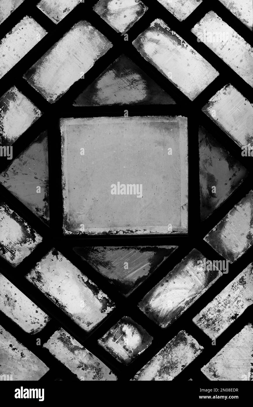 Geometric shapes of a beautiful medieval stained glass window in a ...