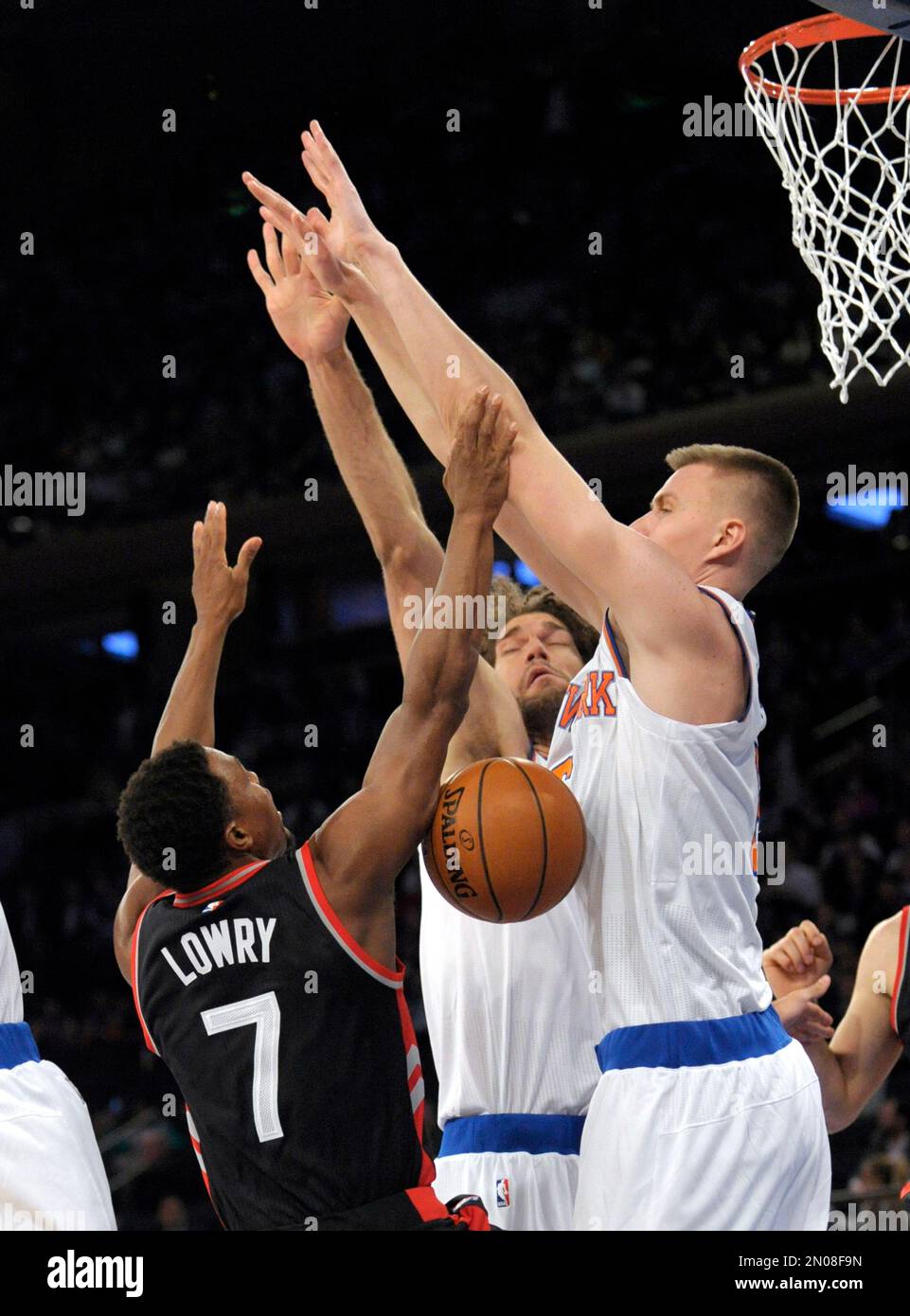 New York Knicks' Kristaps Porzingis, right, and Robin Lopez block a ...
