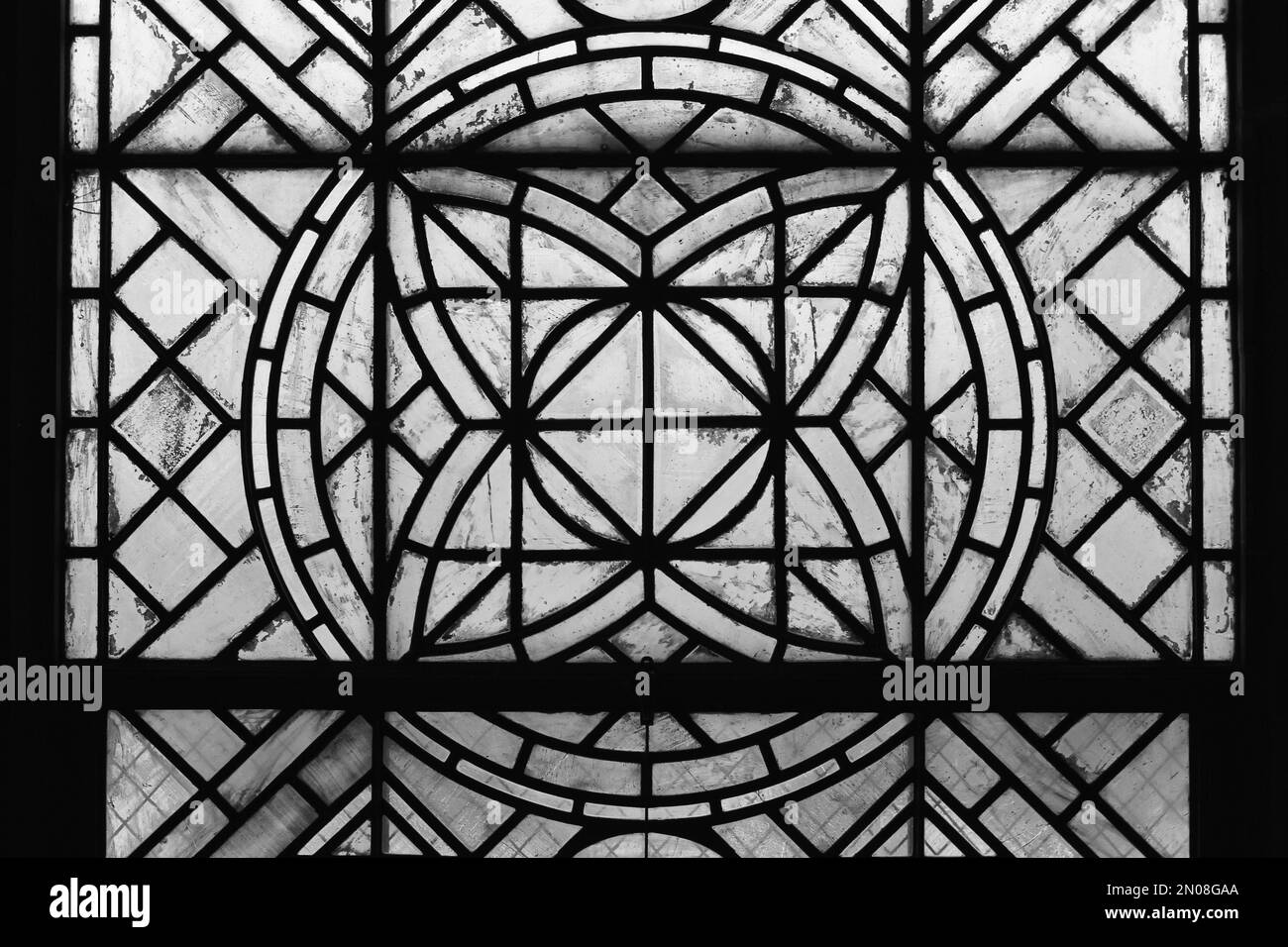 Geometric shapes of a beautiful medieval stained glass window in a ...