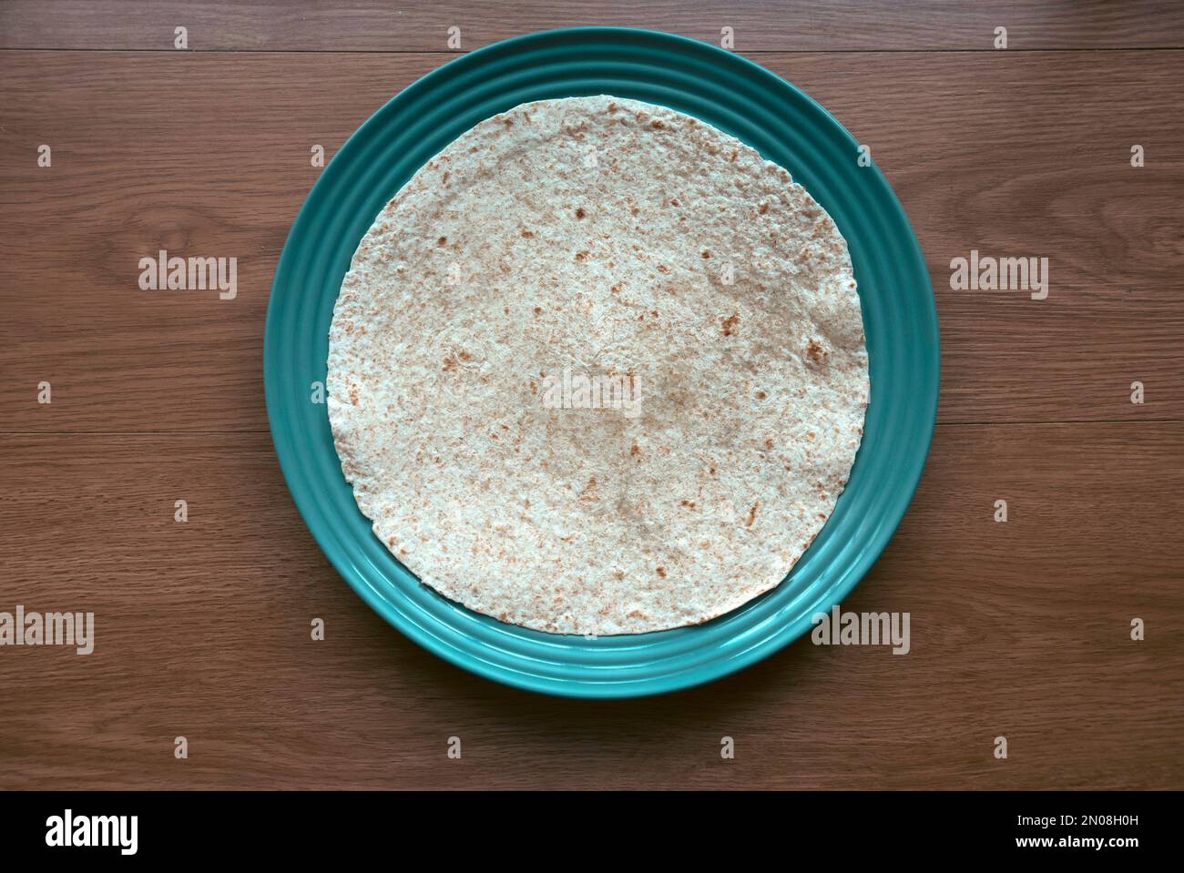 Wholegrain wraps on a green plate Stock Photo - Alamy