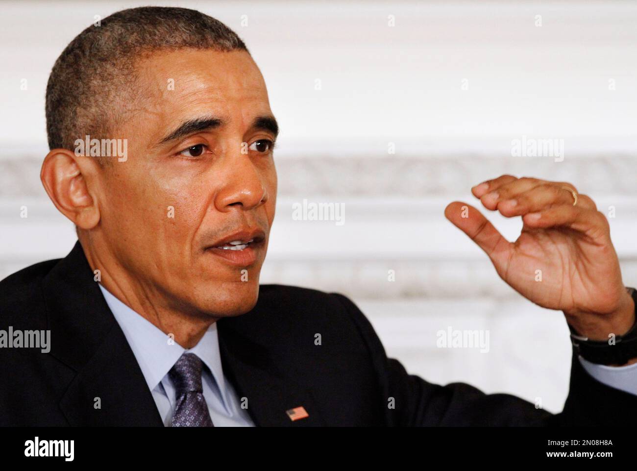 President Barack Obama gestures as he speaks during a meeting with ...
