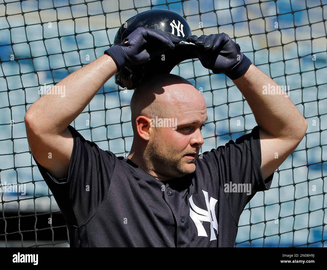 New York Yankees catcher Brian McCann cools off after taking batting practice during a spring ...