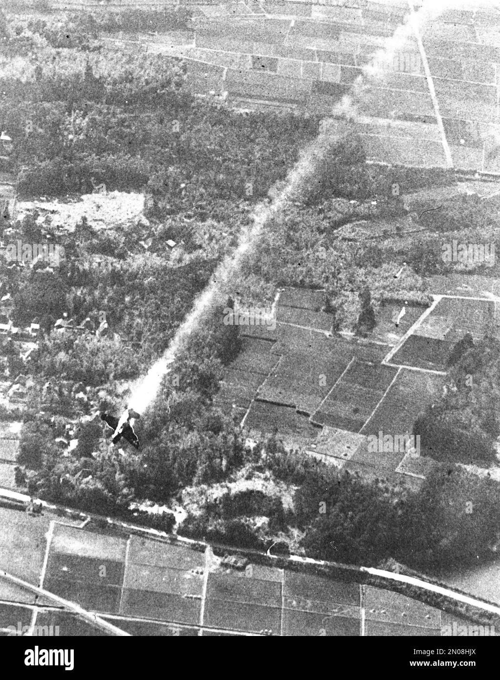 A U.S. Navy Helldiver plane roars comet-like across the sky after it ...