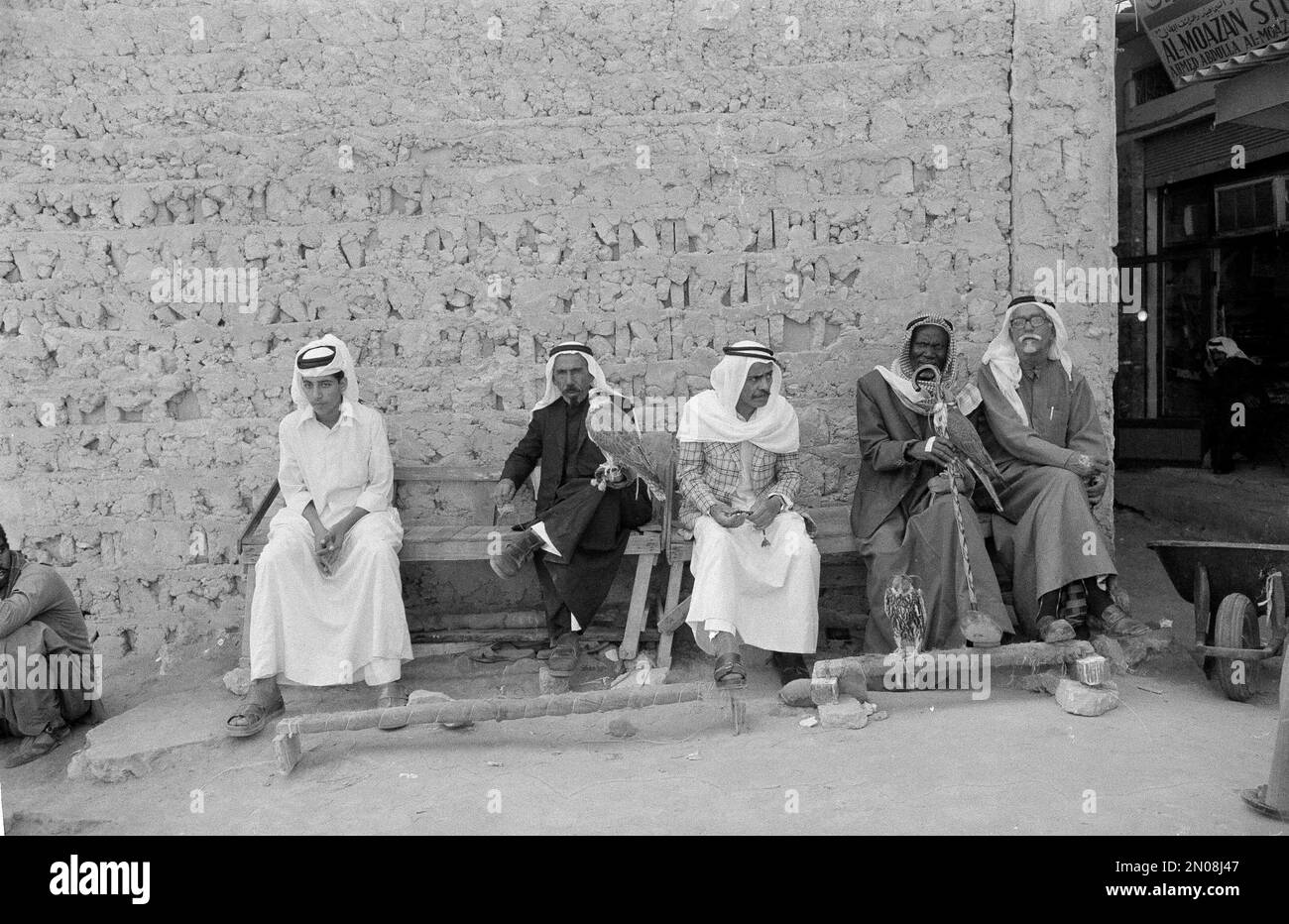 Men sit on a bench in Doha, Qatar, 1977. (AP Photo/Bob Dear Stock Photo ...