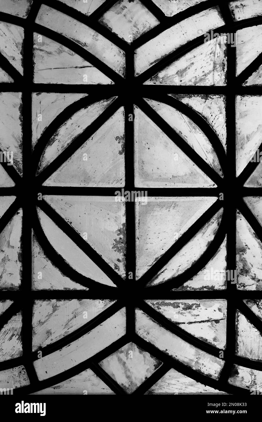 Geometric shapes of a beautiful medieval stained glass window in a ...