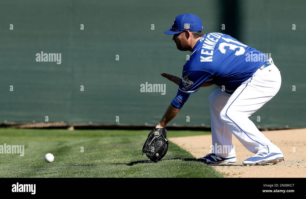Kansas City Royals pitcher Ian Kennedy fields a ball during spring ...