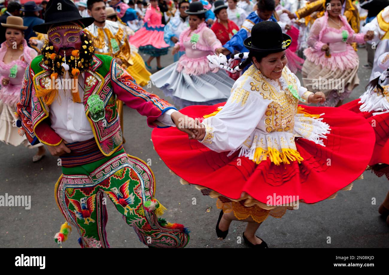 In this Feb. 14, 2016 photo, a man dressed as Chuta, left, and a woman ...