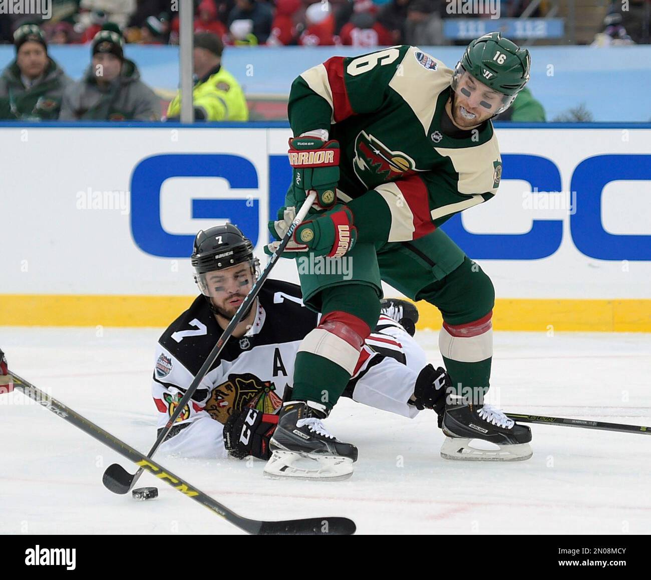 Minnesota Wild left wing Jason Zucker, right, keeps the puck away from ...