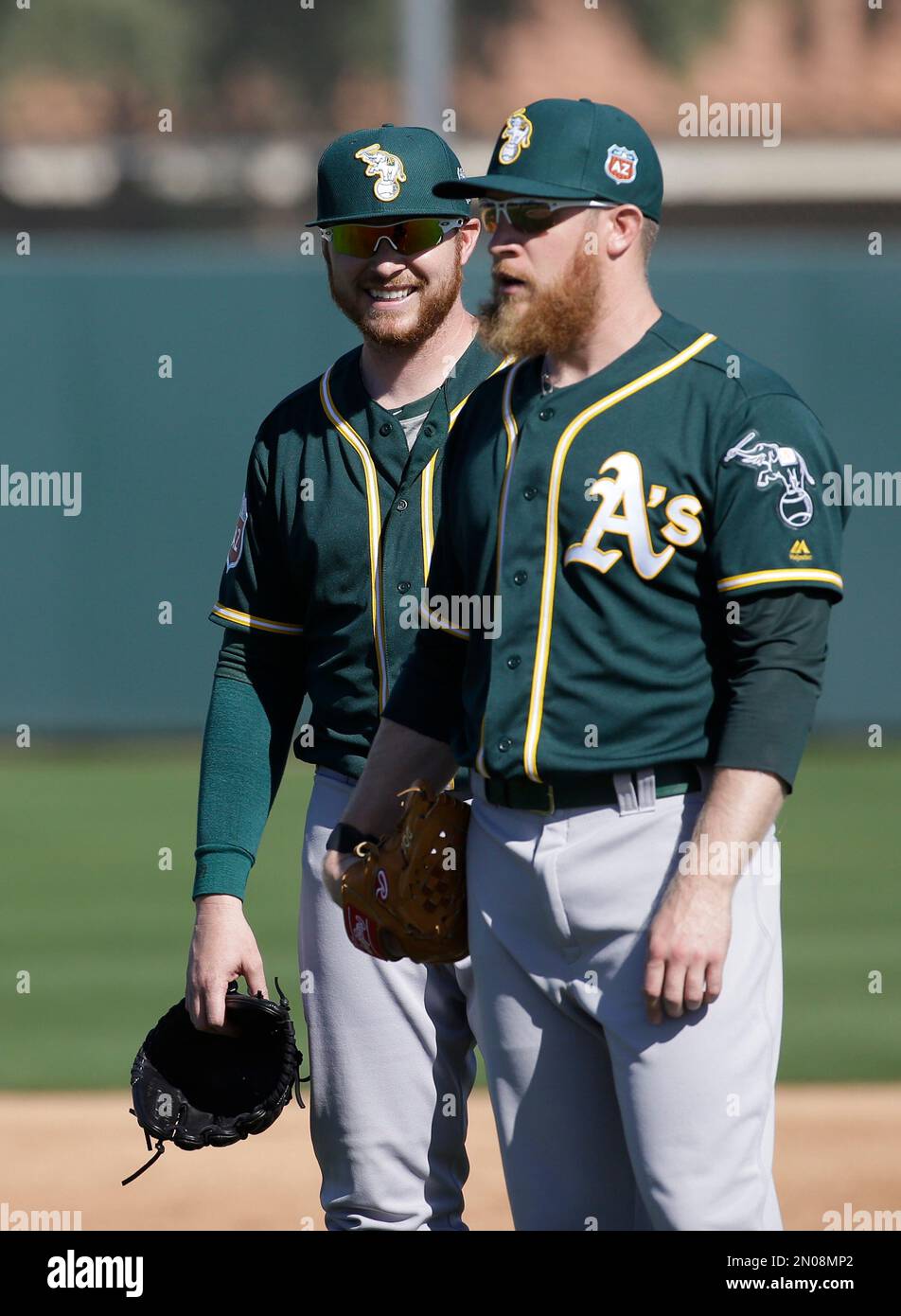 Oakland Athletics relief pitcher Sean Doolittle, right, watches with ...