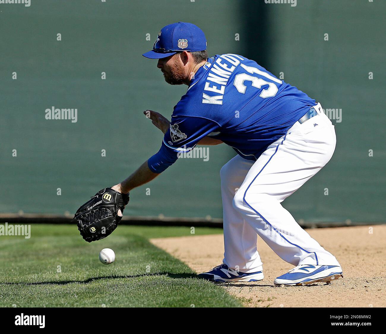 Kansas City Royals pitcher Ian Kennedy fields a ball during spring ...