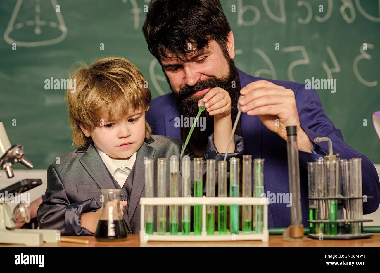 laboratory research and development. bearded man teacher with little ...