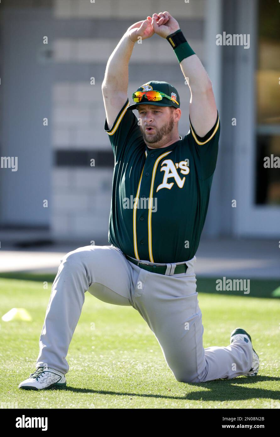 Oakland Athletics catcher Stephen Vogt warms up before spring training ...