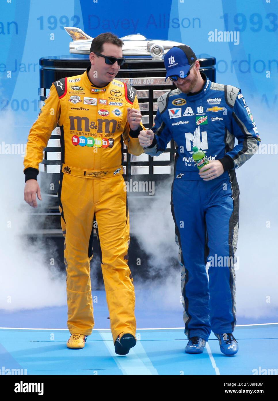 Dale Earnhardt Jr, right, bumps fists with Kyle Busch, left, as they ...