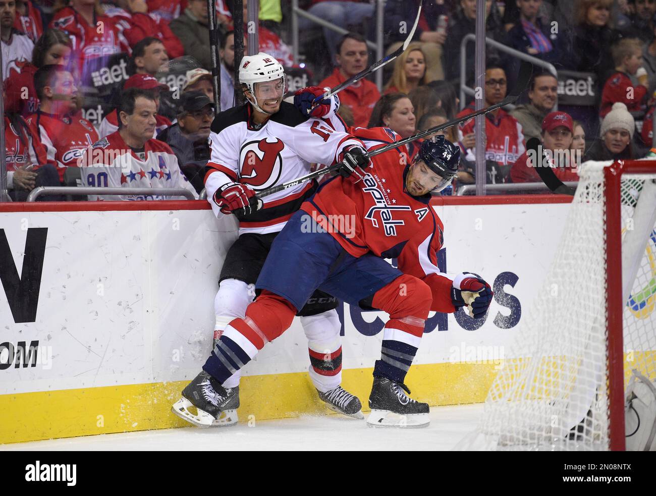 Washington Capitals defenseman Brooks Orpik (44) battles along the boards with New Jersey Devils ...