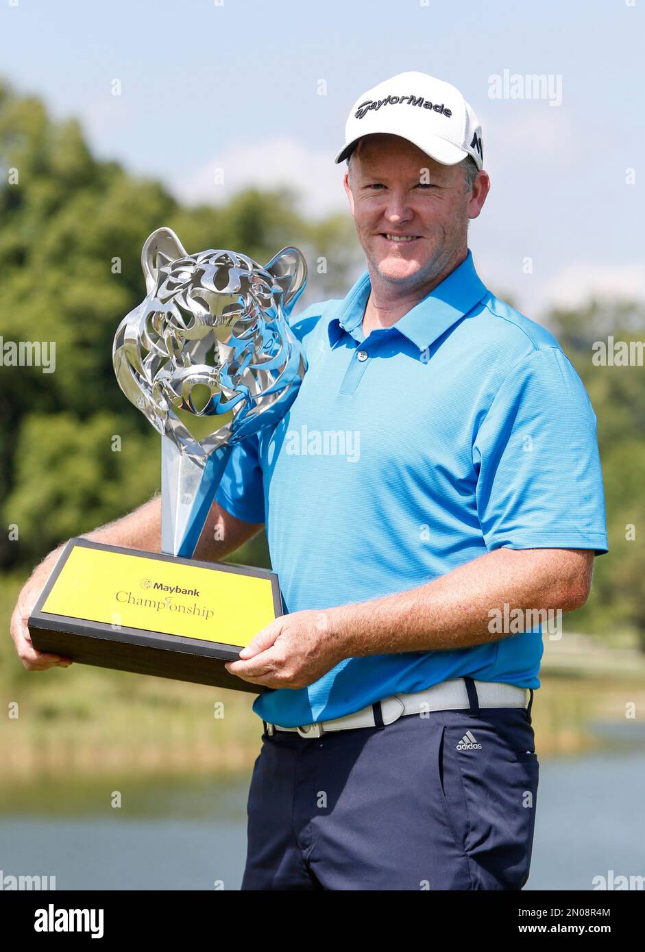 Marcus Fraser of Australia poses for a photograph with his trophy after ...