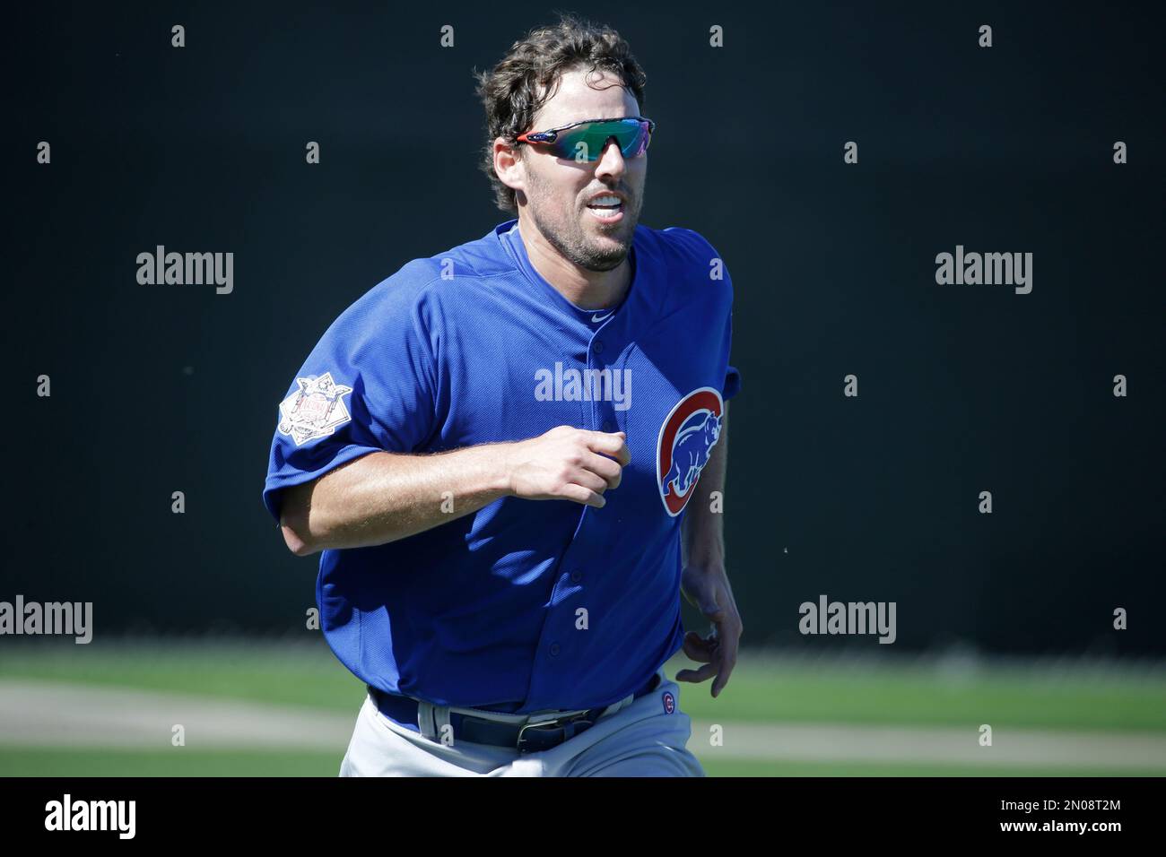 Chicago Cubs starting pitcher John Lackey runs during a spring baseball ...