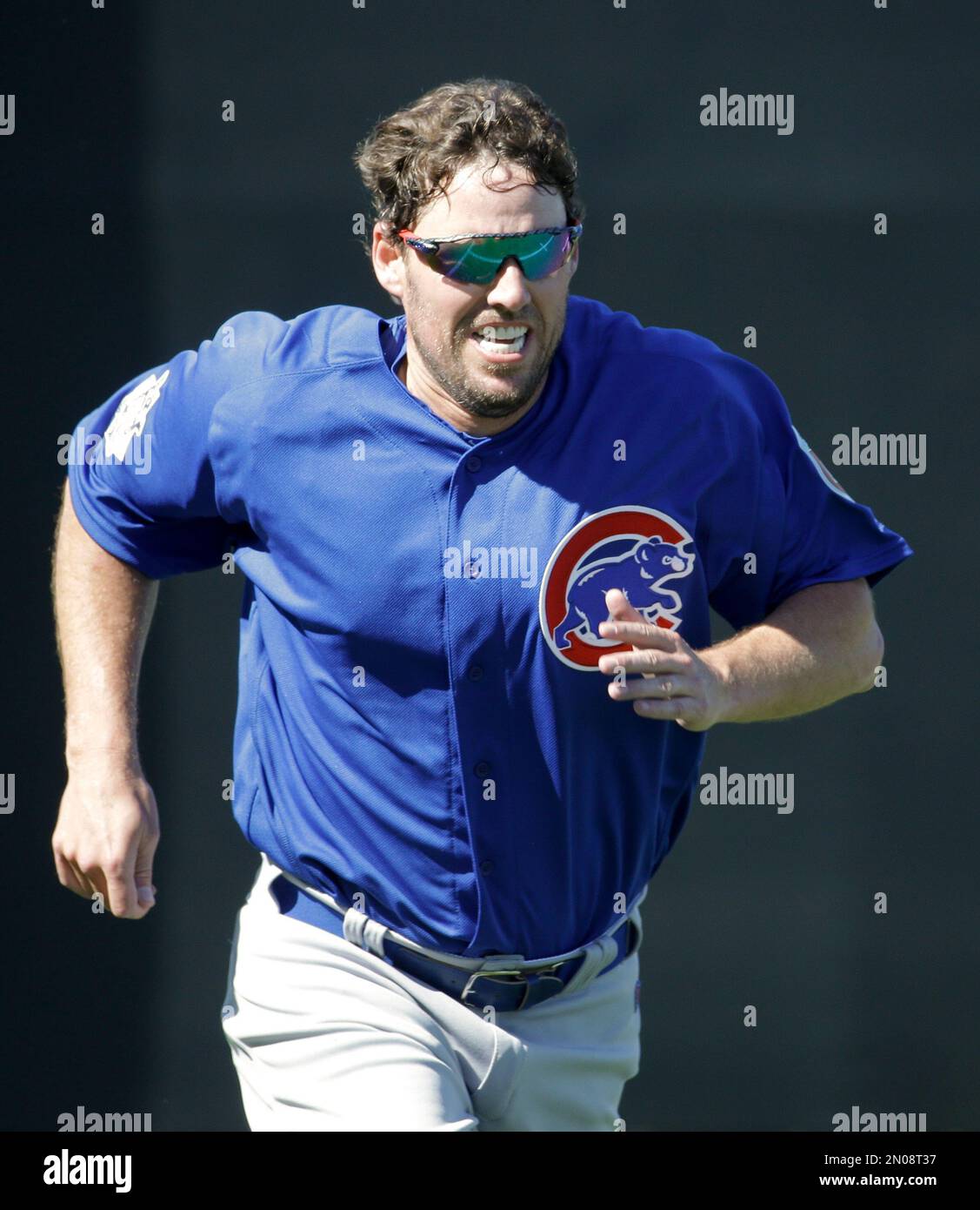 Chicago Cubs starting pitcher John Lackey runs during a spring baseball ...