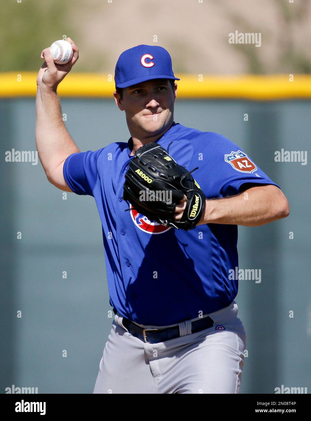Chicago Cubs starting pitcher Adam Warren throws during a spring ...
