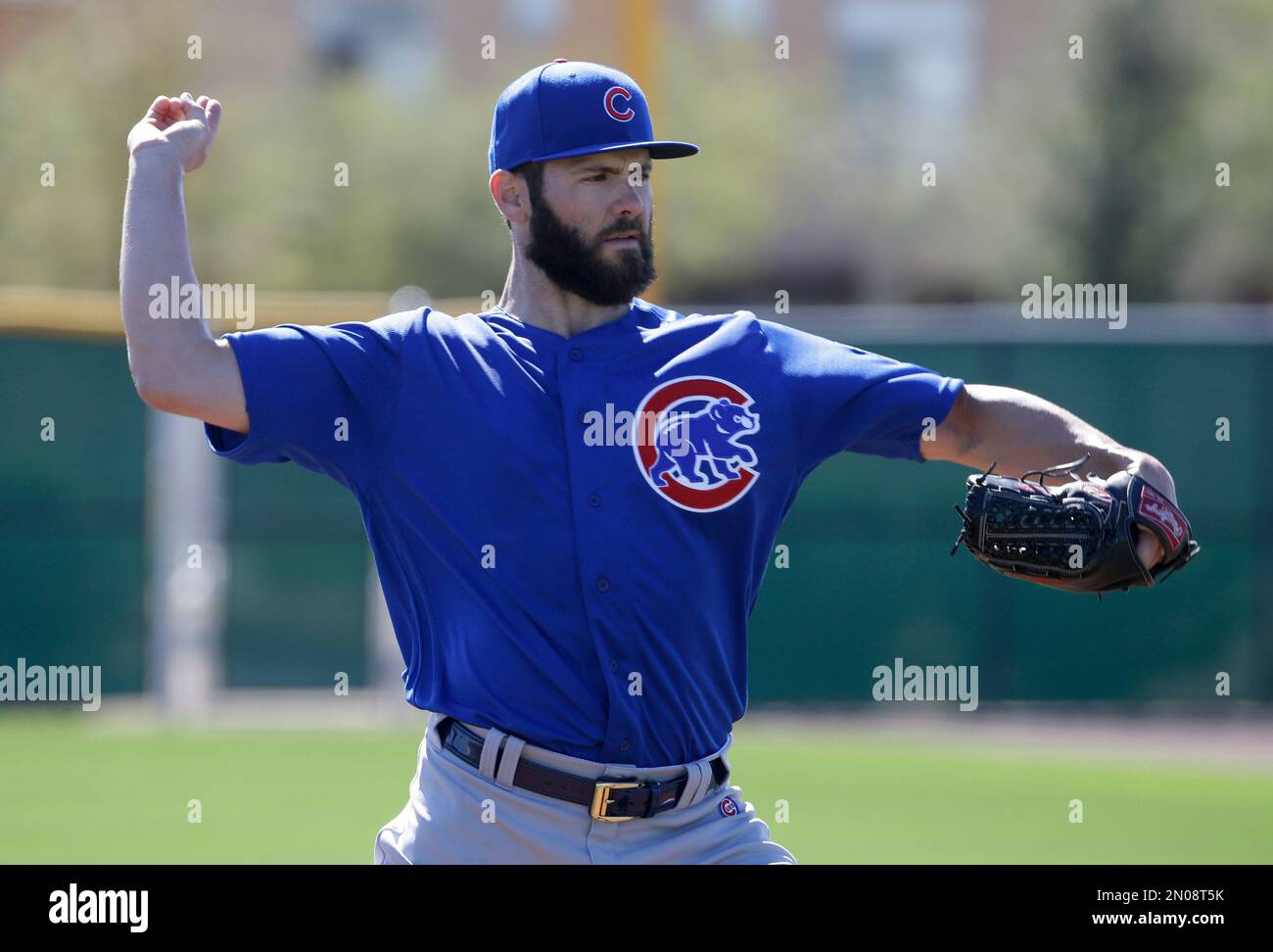 Chicago Cubs starting pitcher Jake Arrieta warms up during a spring ...