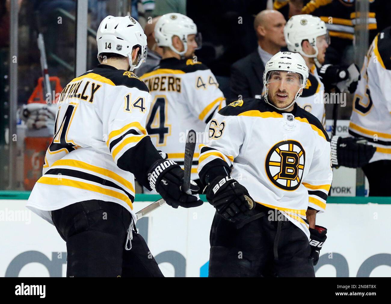 Boston Bruins' Brett Connolly (14) congratulates Brad Marchand (63) on ...