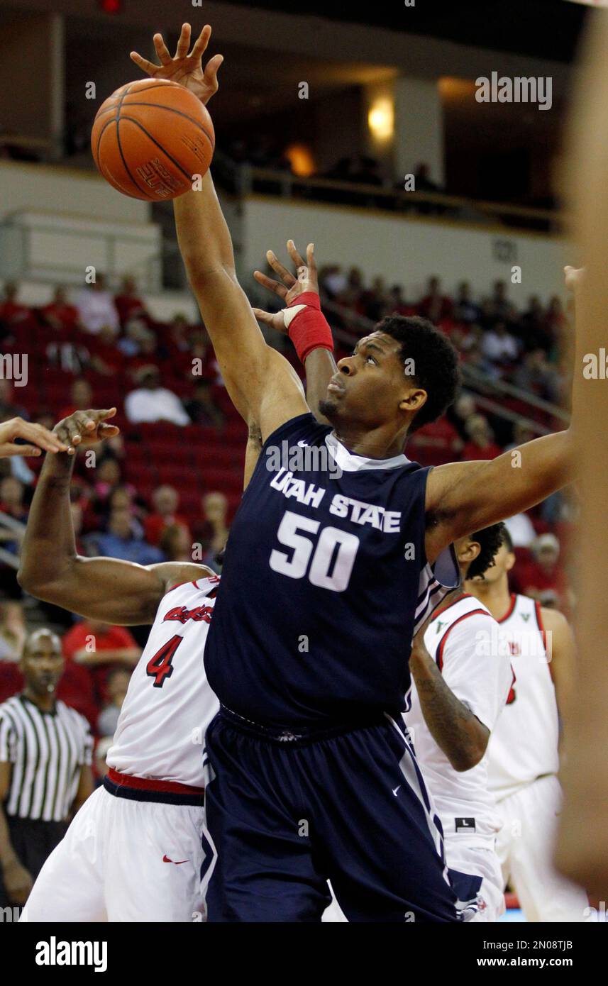 Utah State's Elston Jones (50) goes up for a rebound against Fresno ...