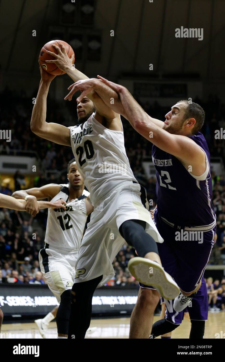 Purdue center A.J. Hammons (20) grabs a rebound in front of ...