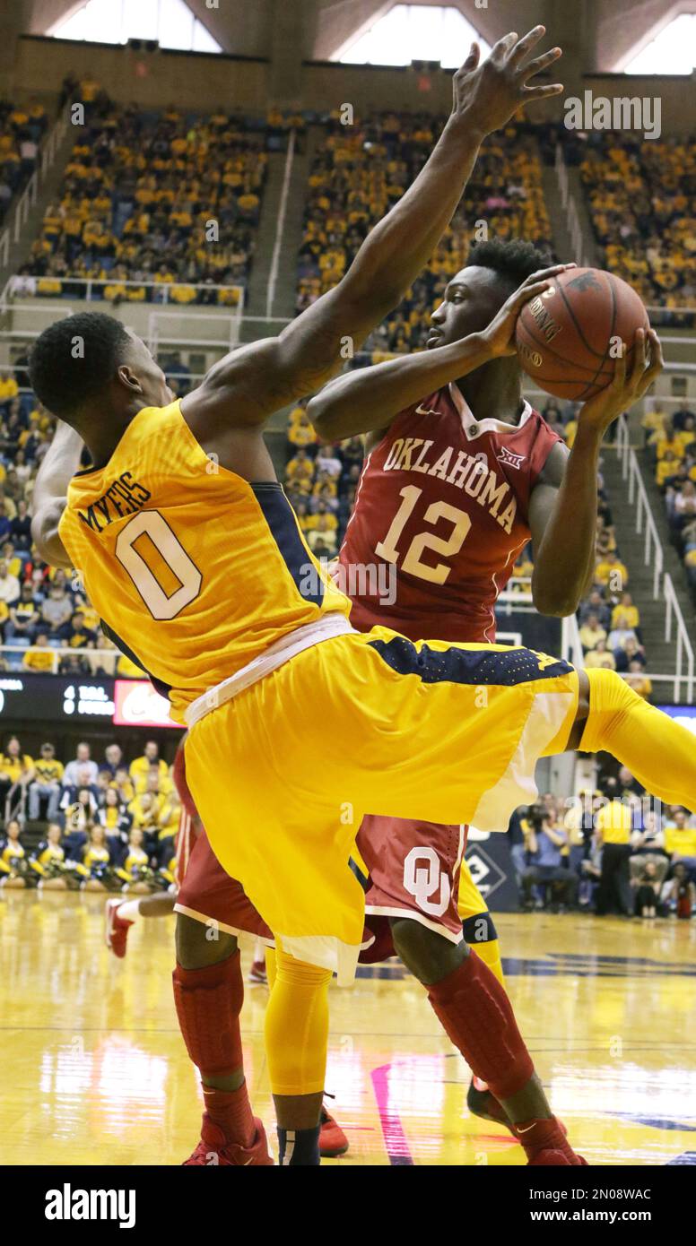 Oklahoma forward Khadeem Lattin (12) looks to make a pass as West ...