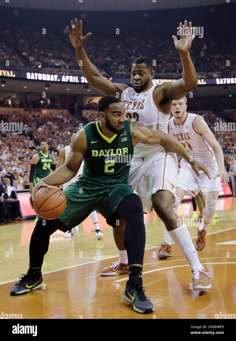 Baylor forward Rico Gathers (2) works the ball around Texas forward ...