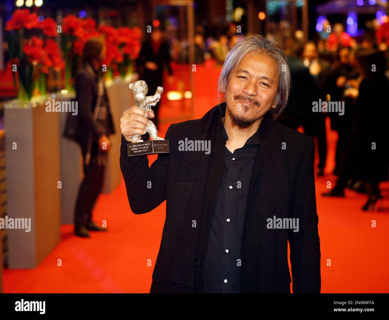 Lav Diaz, director of 'Hele Sa Hiwagang Hapis' poses for photographers ...
