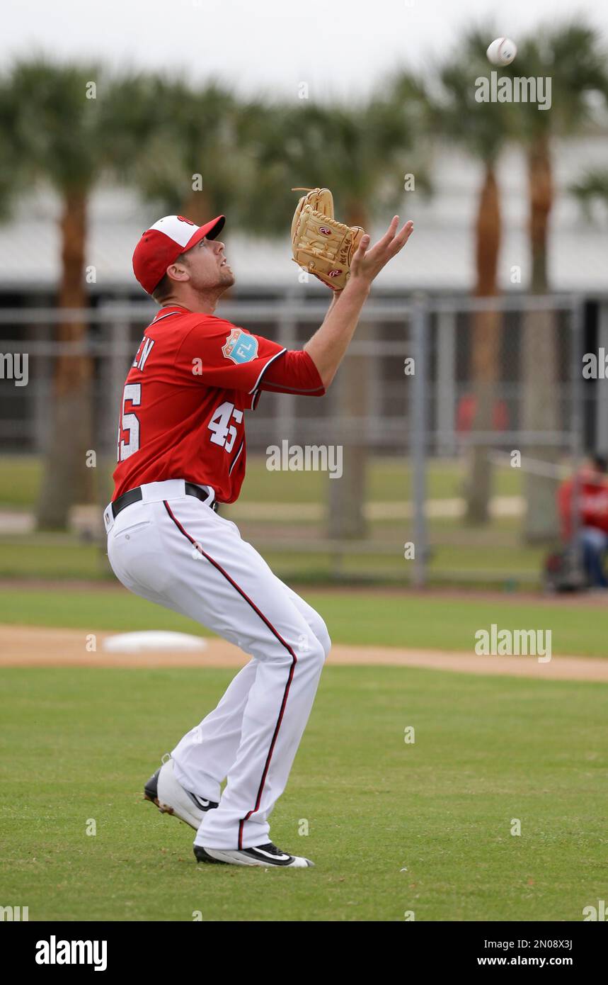 Washington Nationals pitcher Blake Treinen catches a pop fly in a drill ...
