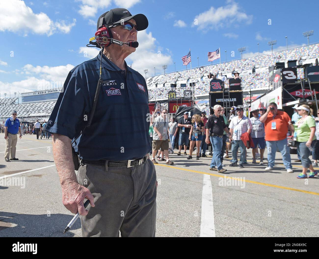 Team owner Joe Gibbs walks through the garage area during practice for ...