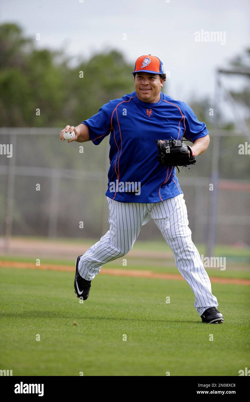 New York Mets pitcher Bartolo Colon takes part in a drill during spring ...