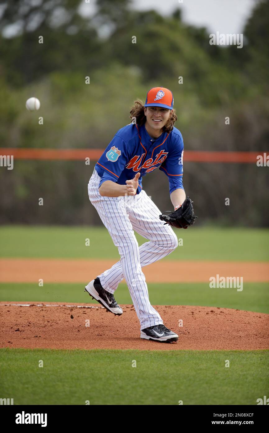 New York Mets pitcher Jacob deGrom fields a ball during spring training ...