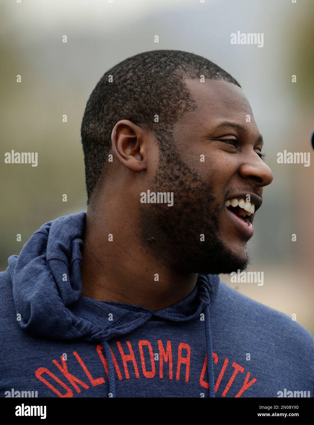 Kansas City Royals' Lorenzo Cain talks to the media after a spring ...