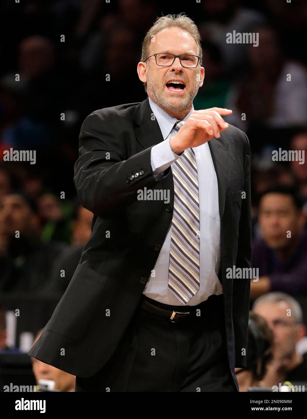 New York Knicks interim coach Kurt Rambis motions to players during the ...