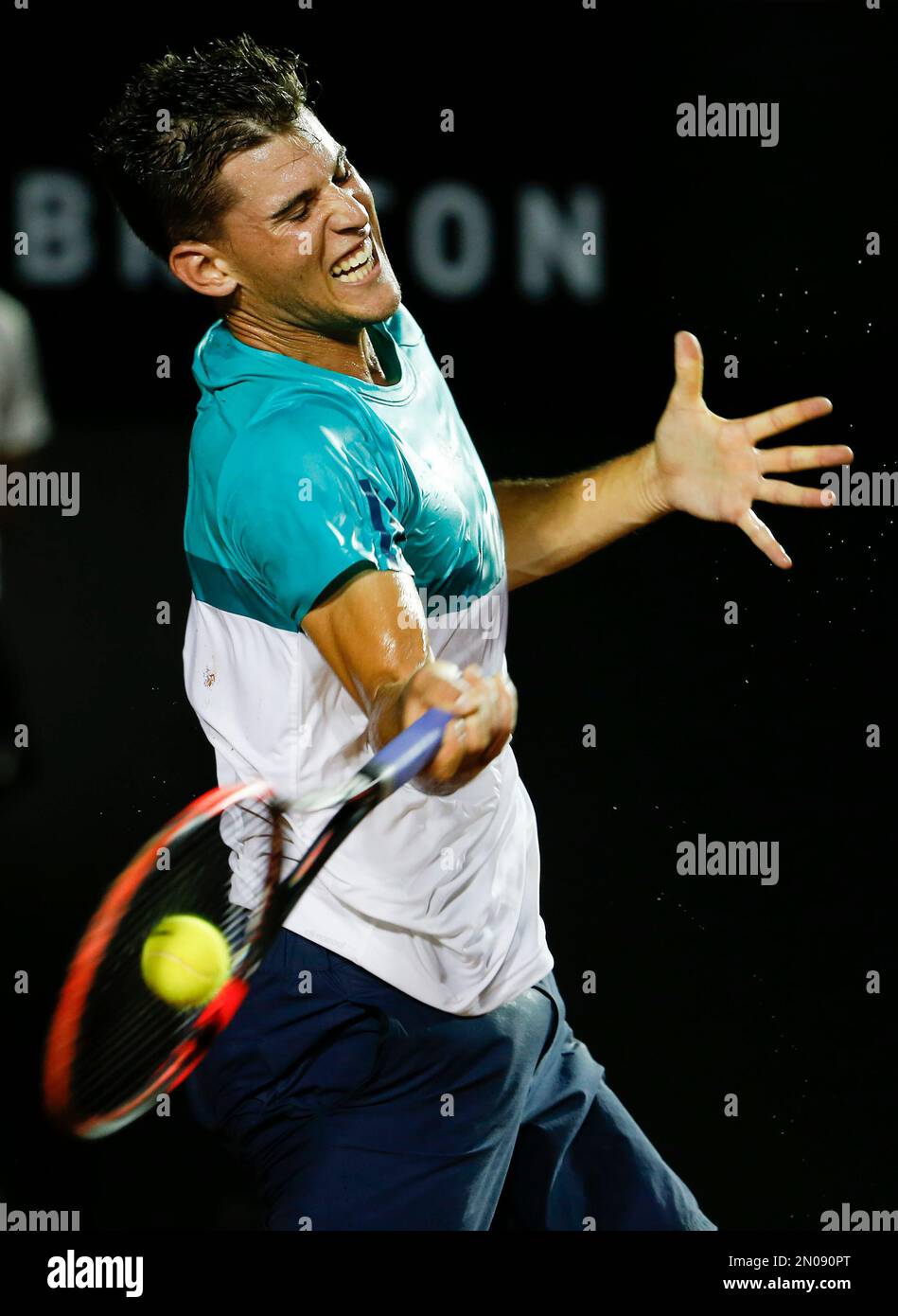 Dominic Thiem of Austria returns the ball to David Ferrer of Spain ...