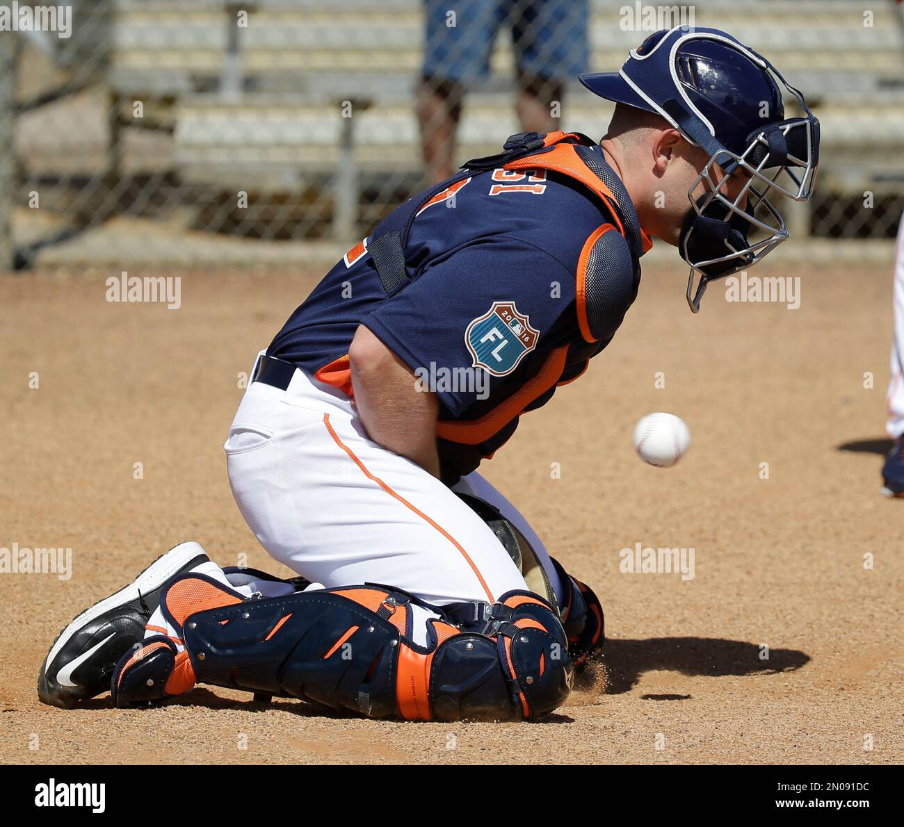 Houston Astros catcher Max Stassi goes through a drill blocking a wild ...