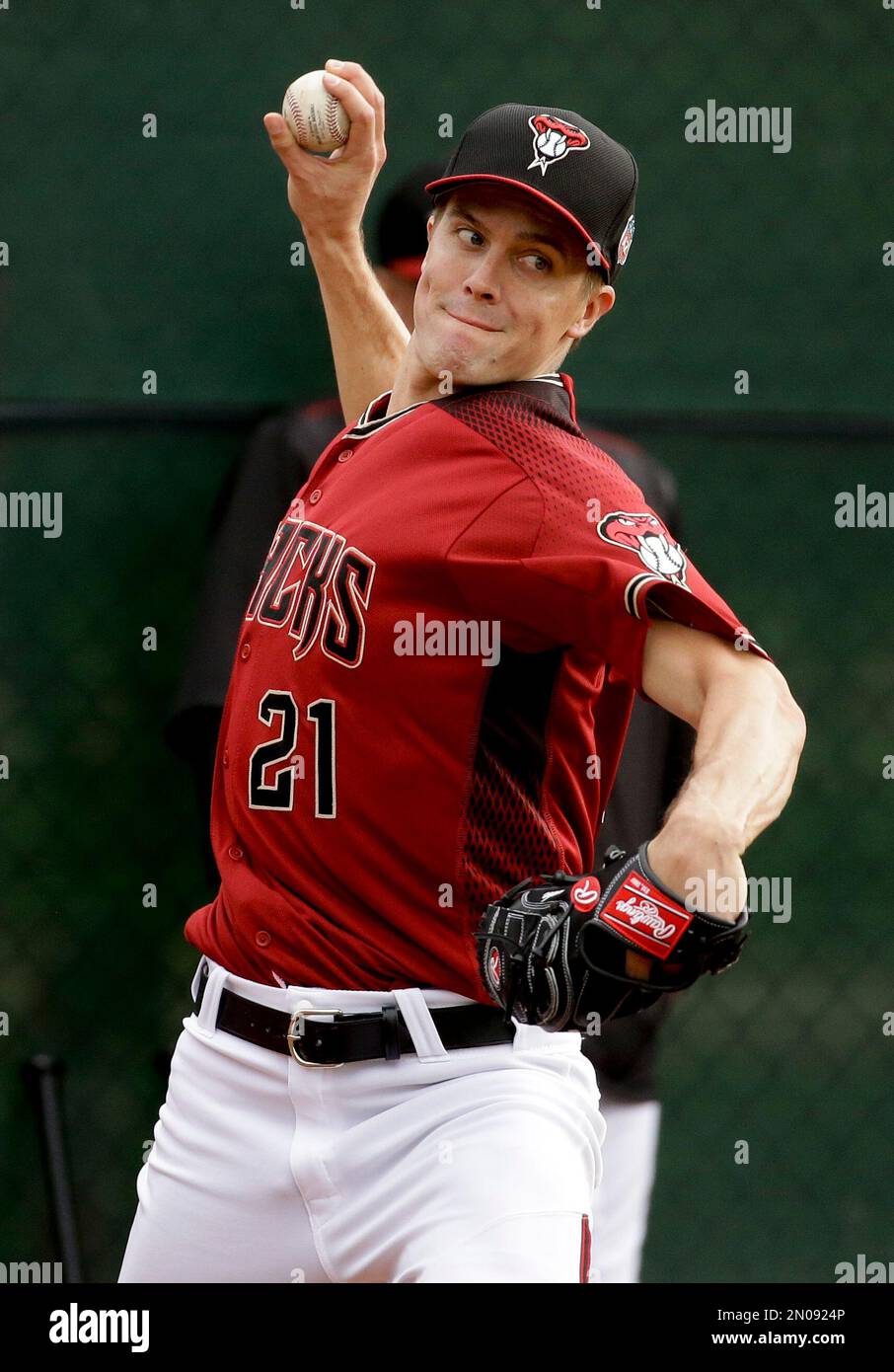 Arizona Diamondbacks pitcher Zack Greinke fields a ball during a spring baseball practice in ...