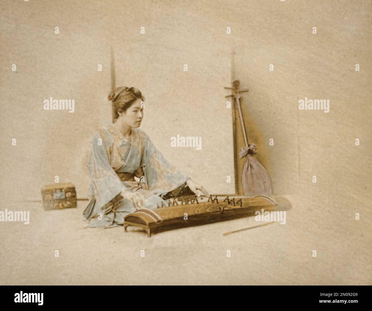 A photograph of a Japanese woman playing music. Published in Views ...