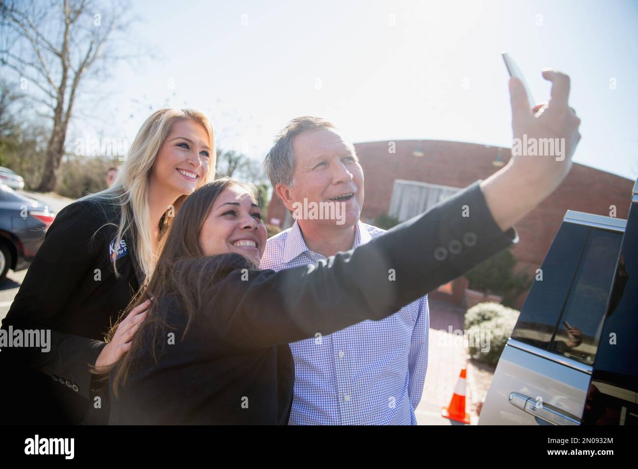 Republican presidential candidate, Ohio Gov. John Kasich takes a photo ...