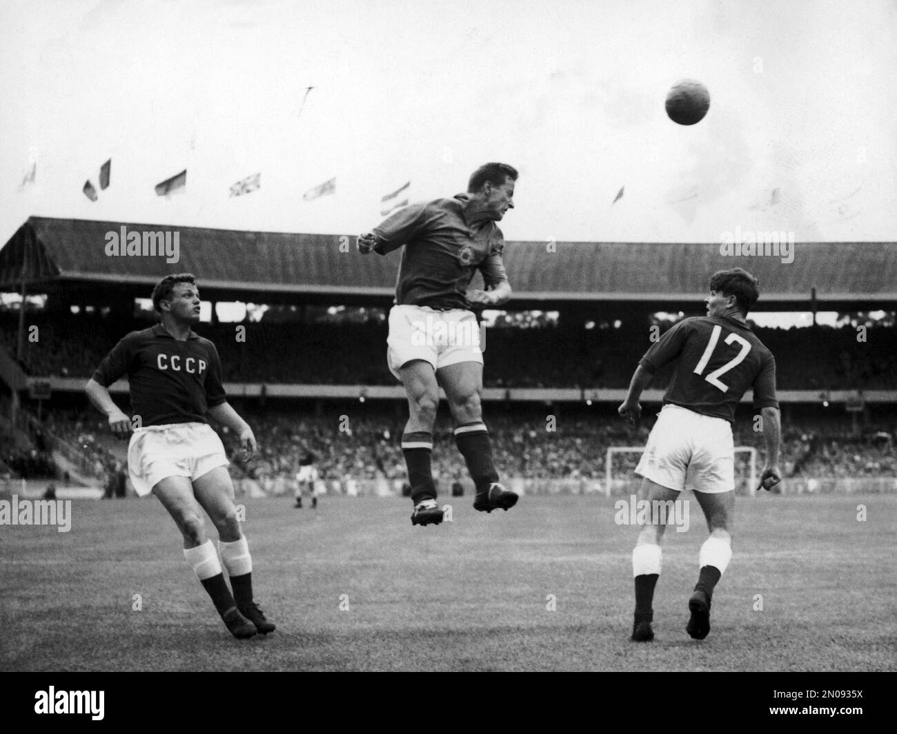 Russia's inside-right, A. Issaev, number 12, and Yugoslavia's right-back, Nikola Radovic, during ...