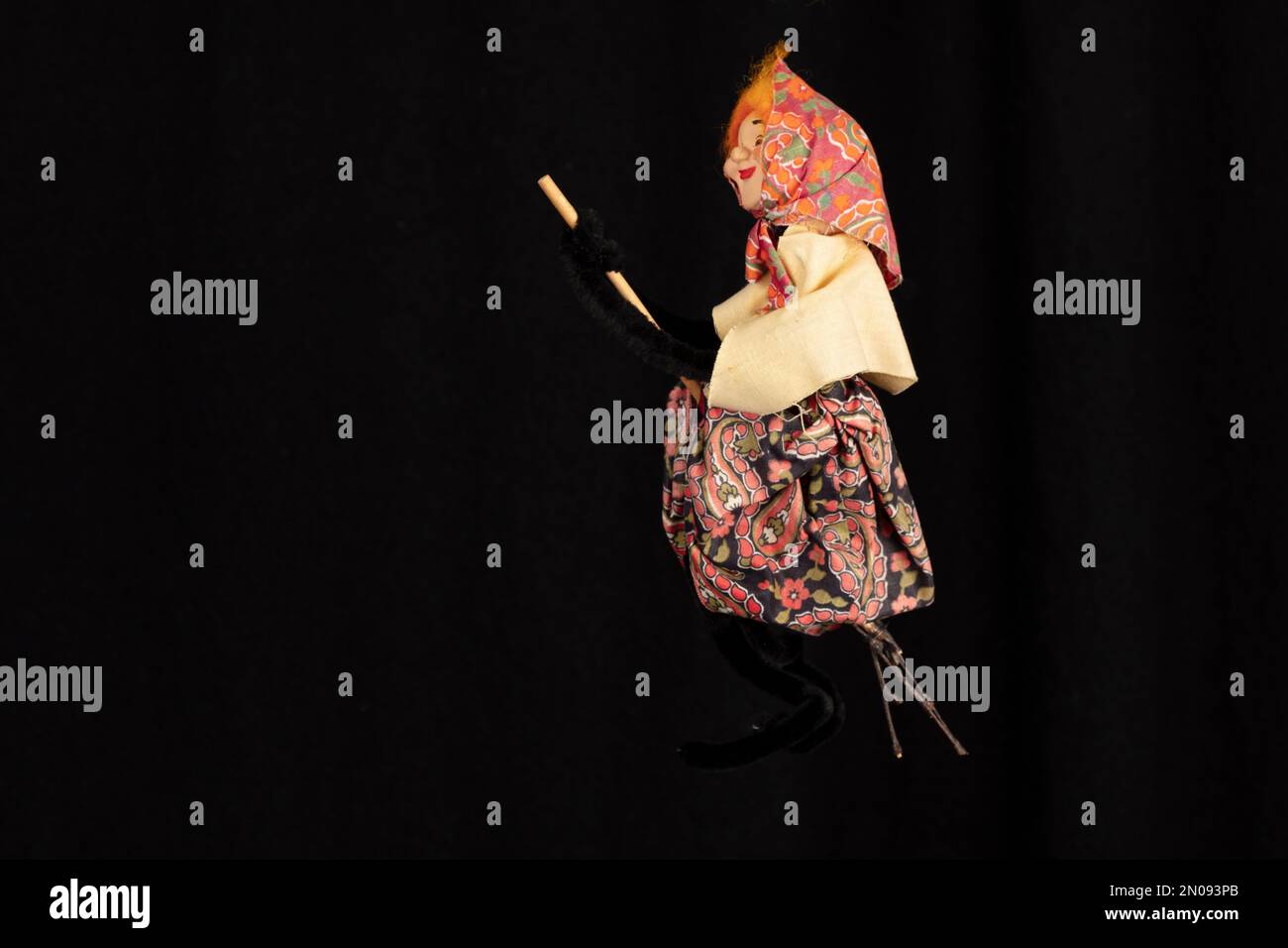 Witch, redhead figure with a scarf on, flying broomstick. Equipment ...