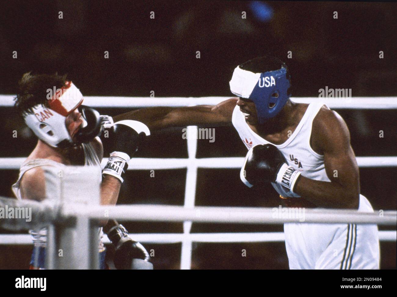 American boxer Frank Tate, right, throws a punch at Canadian boxer ...